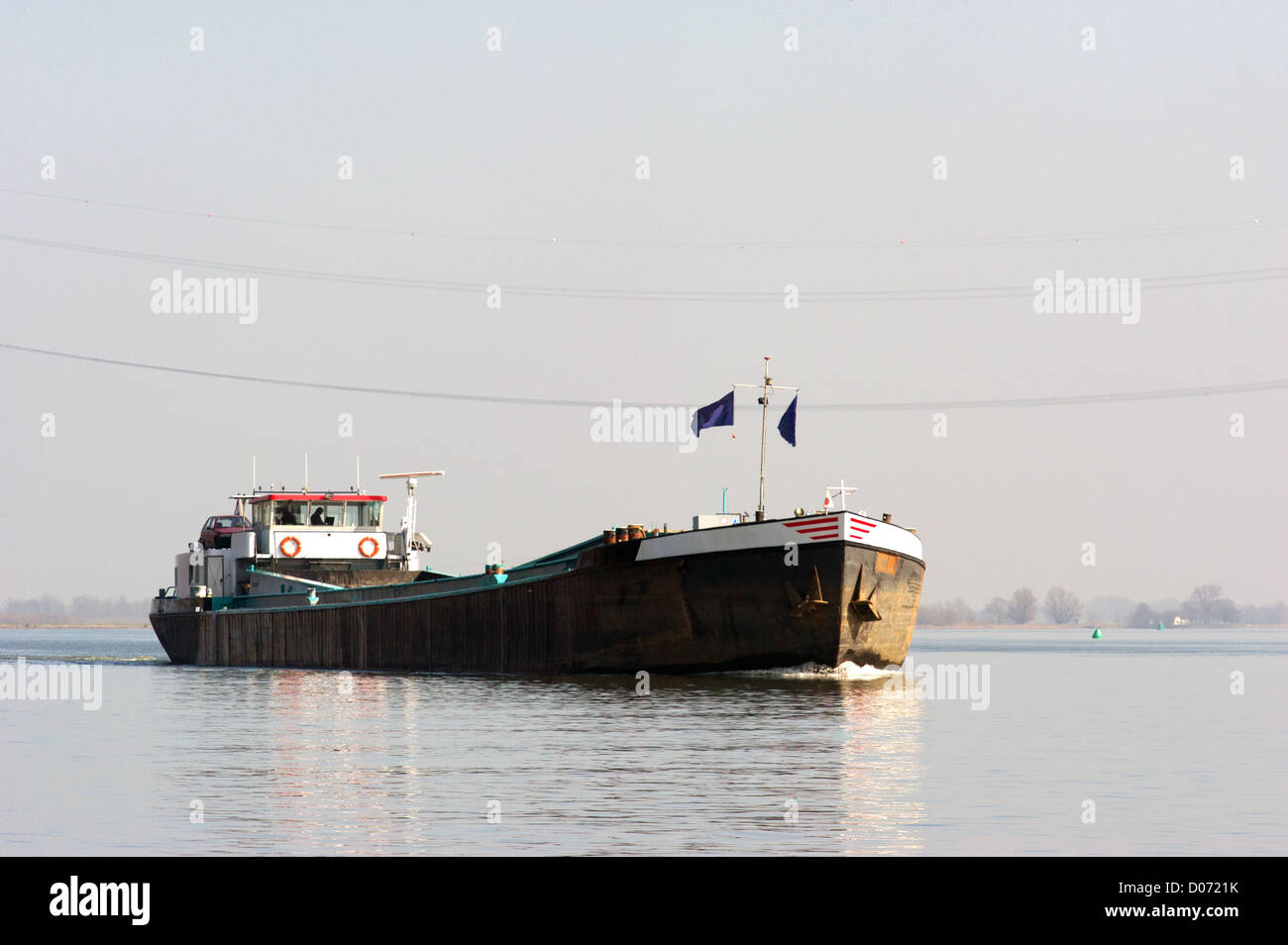 Big cargo ship in Dutch river Stock Photo - Alamy