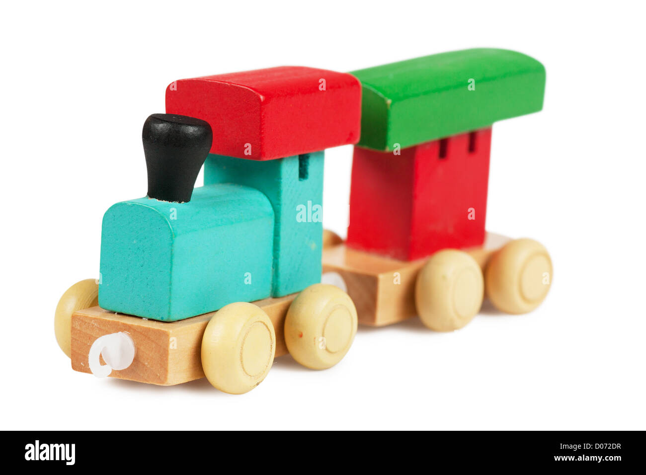 Little wooden toy train isolated over white background Stock Photo - Alamy