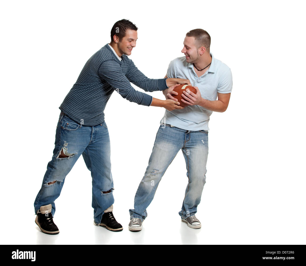Young men play football on Cut Out Stock Images & Pictures - Alamy