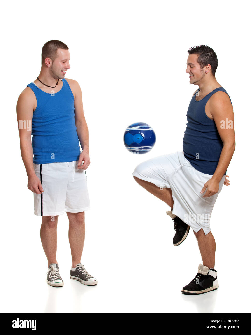 Two men with soccer ball Stock Photo - Alamy