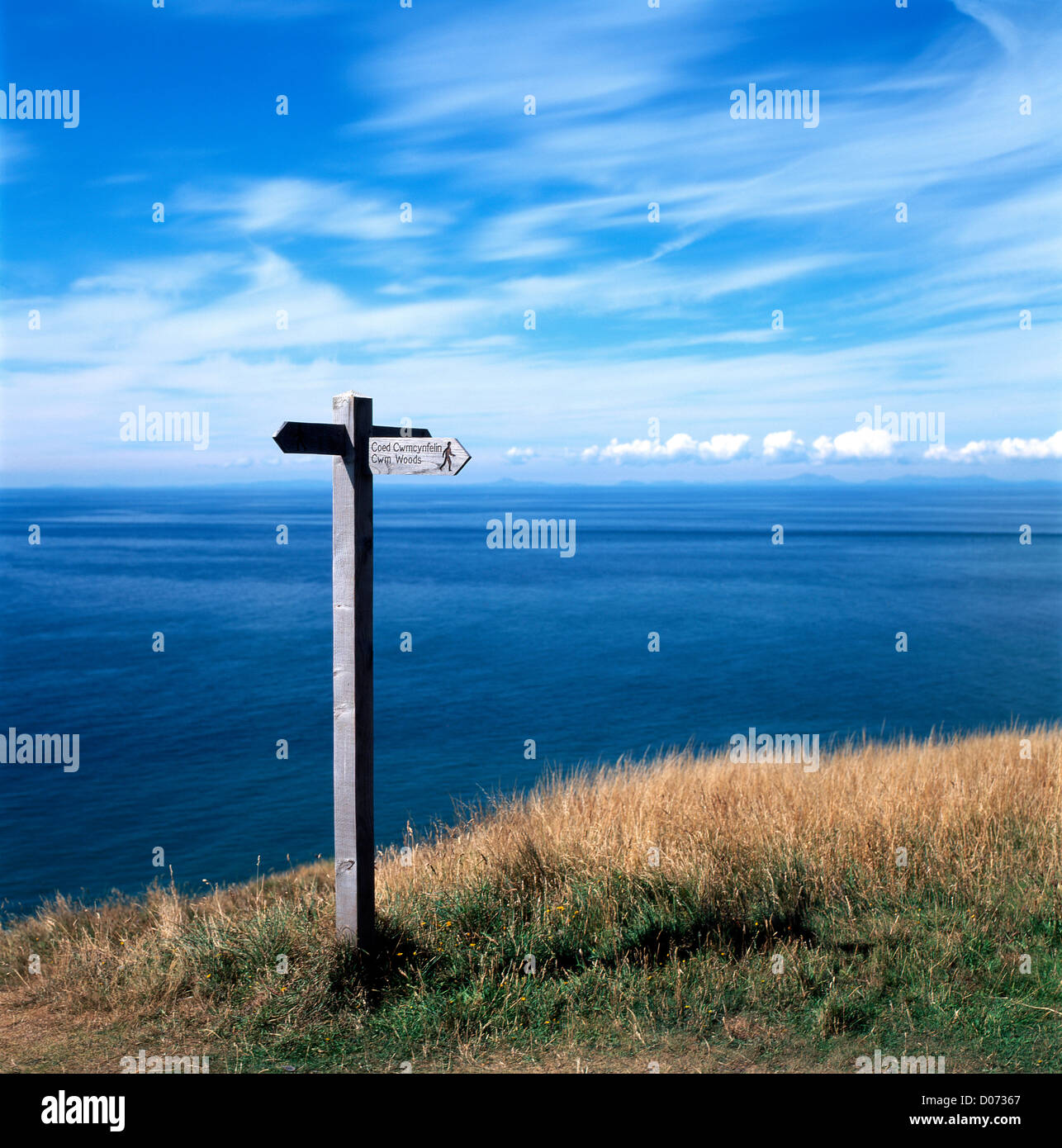 Welsh coastal path signpost near the coast with view of sea and ...