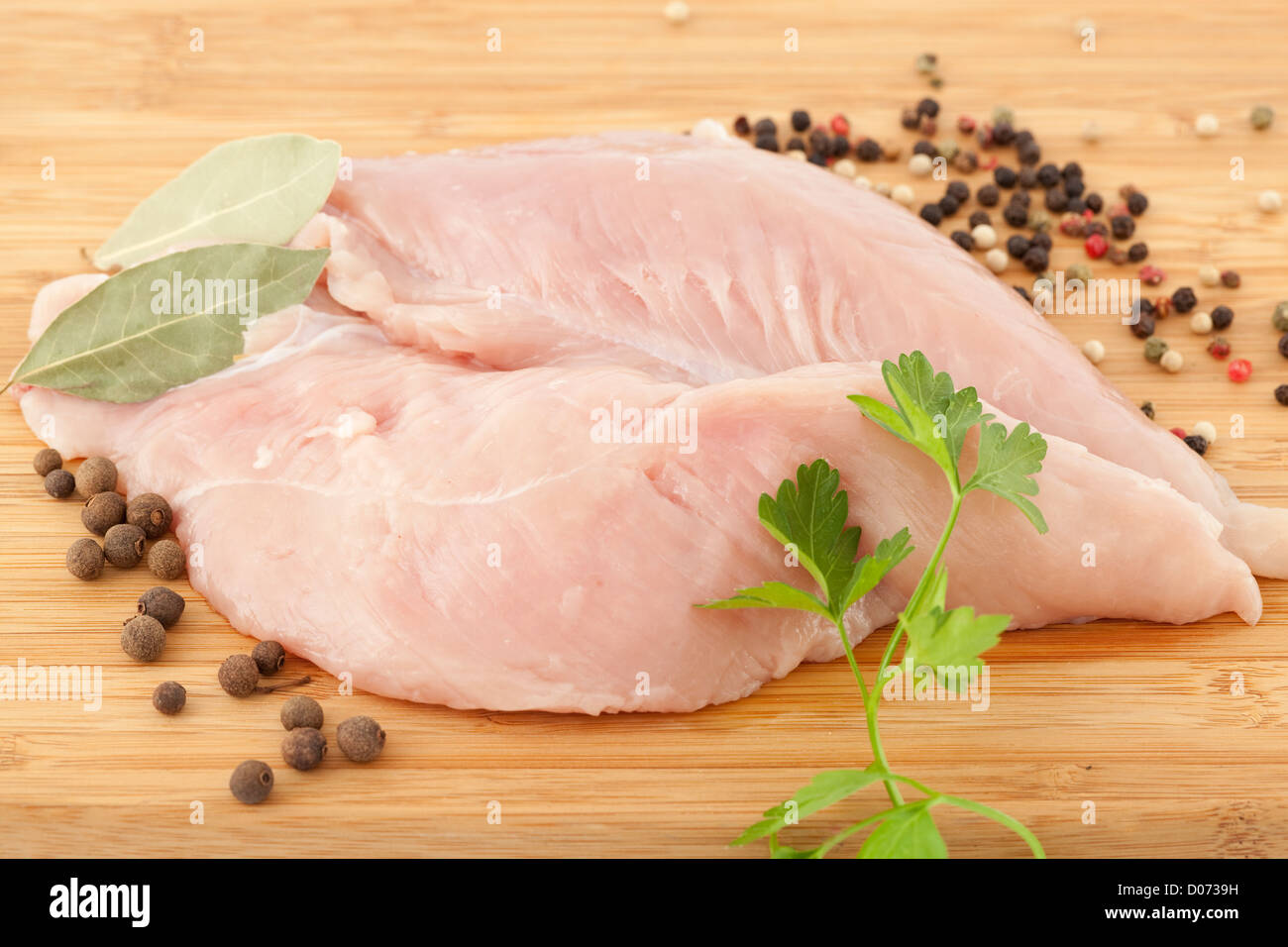white meat and different species spice on plank Stock Photo - Alamy