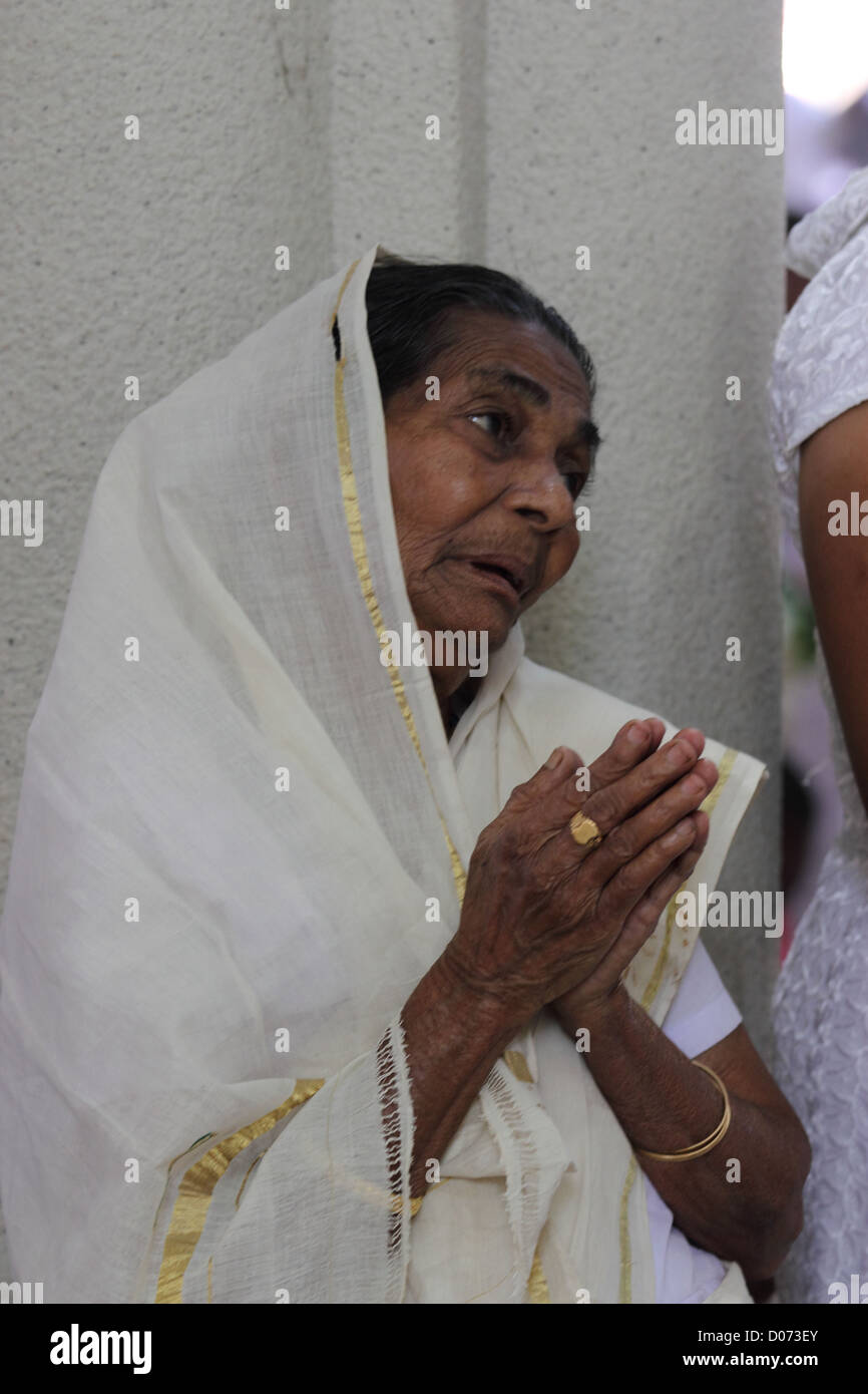 Picture of an old lady worshiping Jesus at the church in Kerala Stock ...