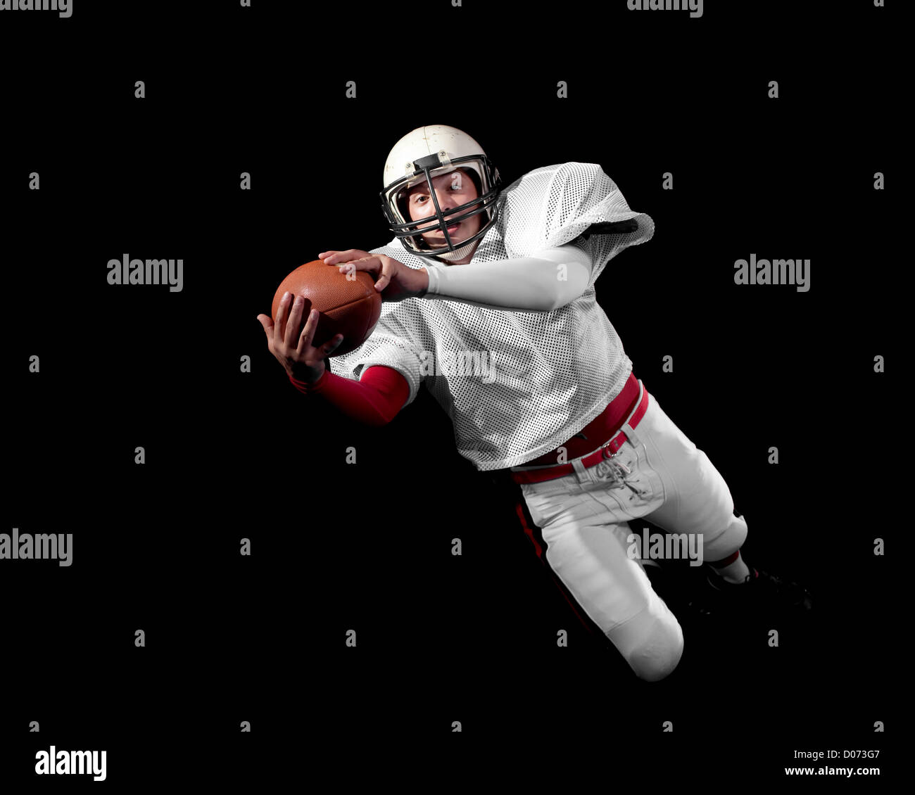 Male football jump hi-res stock photography and images - Alamy