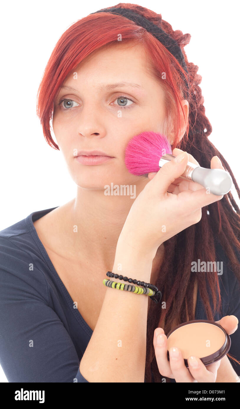 attractive young adult woman applying blusher Stock Photo - Alamy
