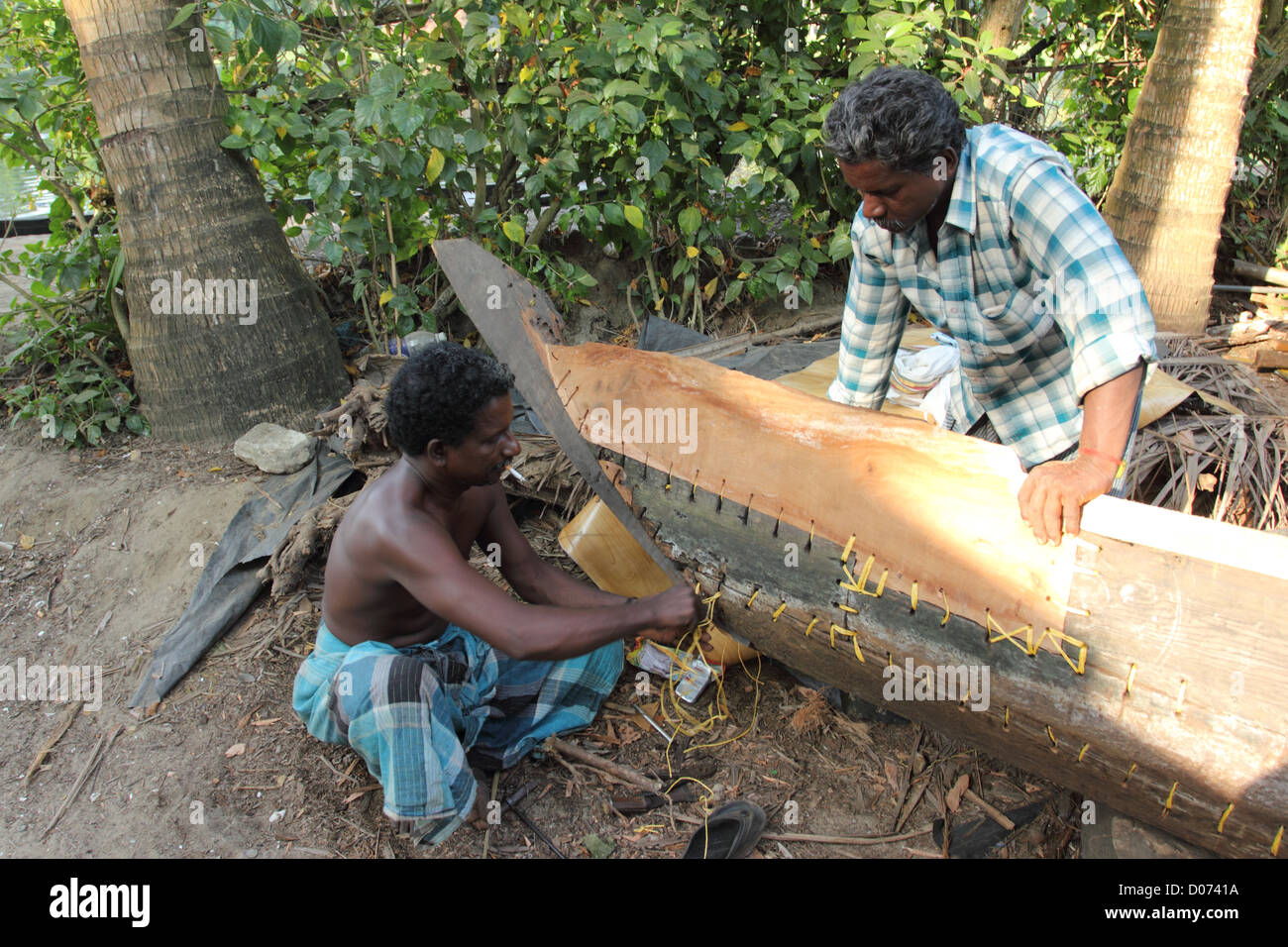 Indian men building boat hi-res stock photography and images - Alamy