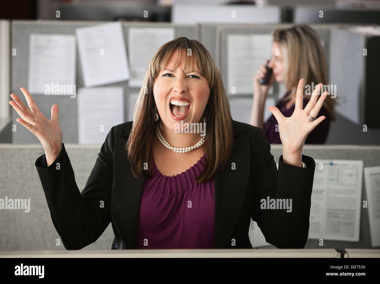 Frustrated woman office worker screaming with hands in air Stock Photo ...