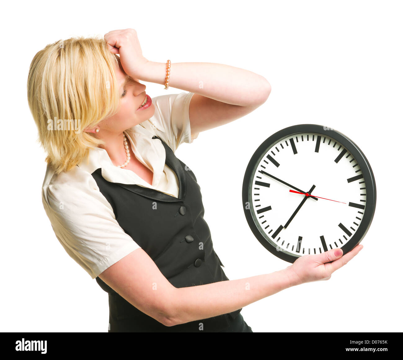 Woman holding and showing a clock, white isolated background Stock ...