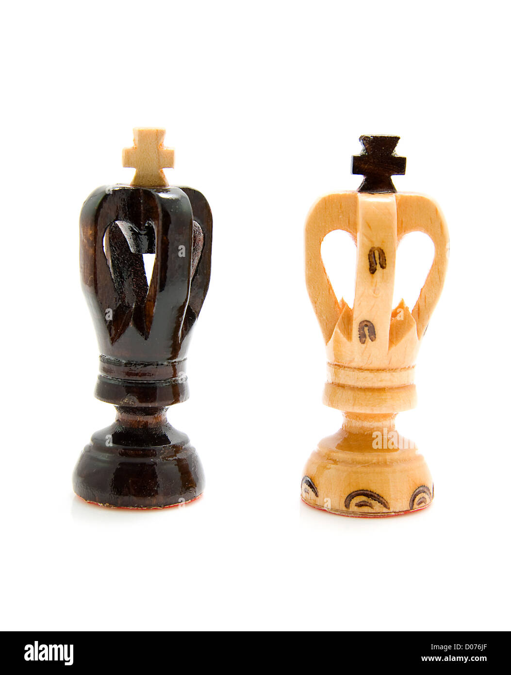 Two wooden king chess pawns over white background Stock Photo - Alamy
