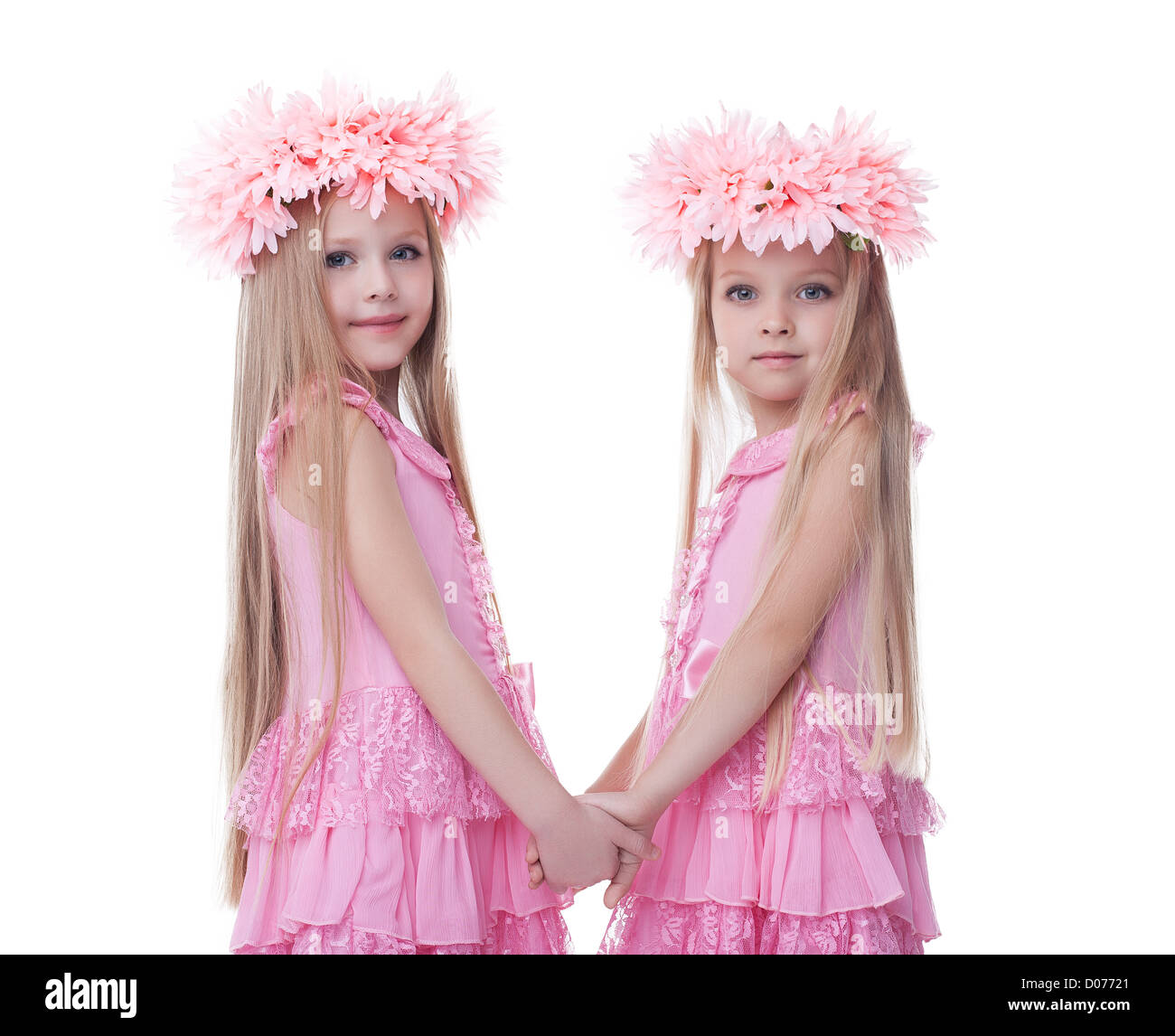 Two little girls posing in Cut Out Stock Images & Pictures - Alamy