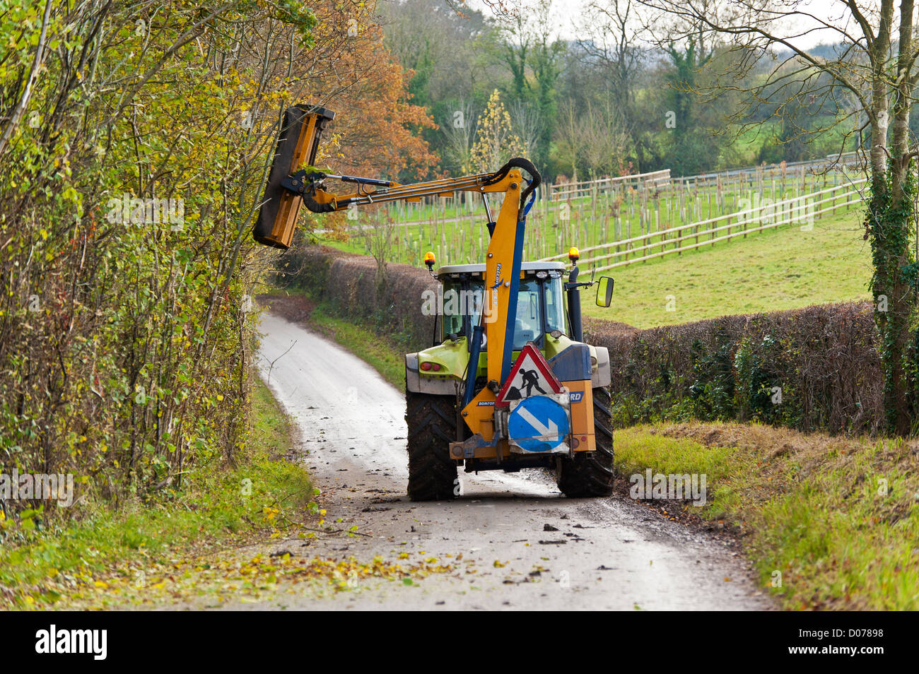 tractor at work cutting back trees Stock Photo - Alamy