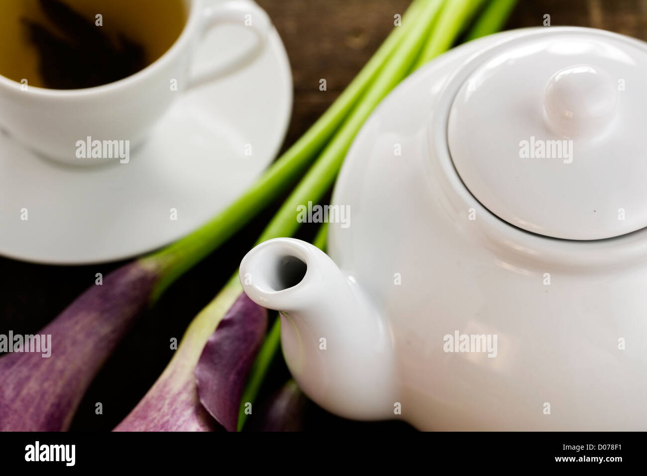 tea set with green tea on a wooden surface with a purple flowers Stock ...