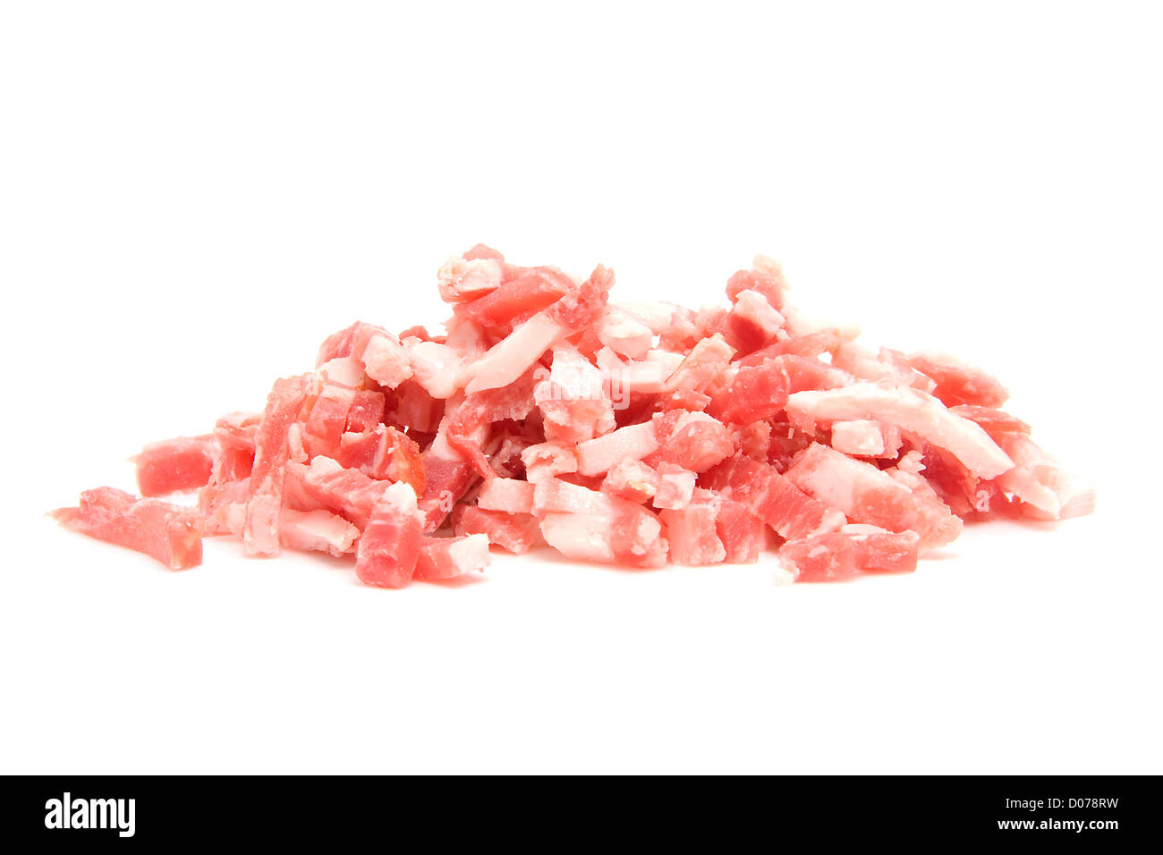 pile of raw diced bacon over white background Stock Photo - Alamy