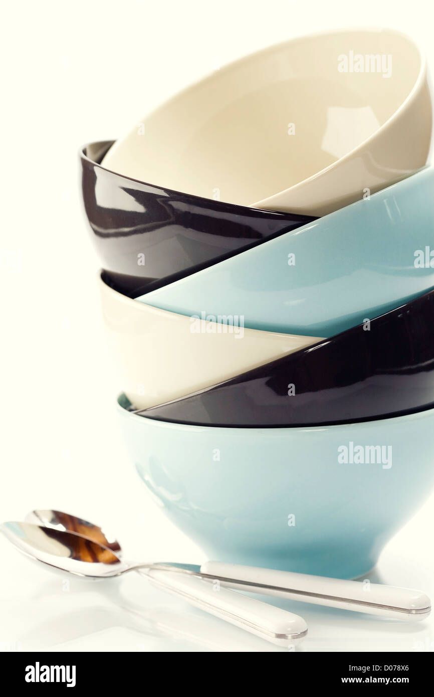 Stack of bowls and spoons Stock Photo - Alamy