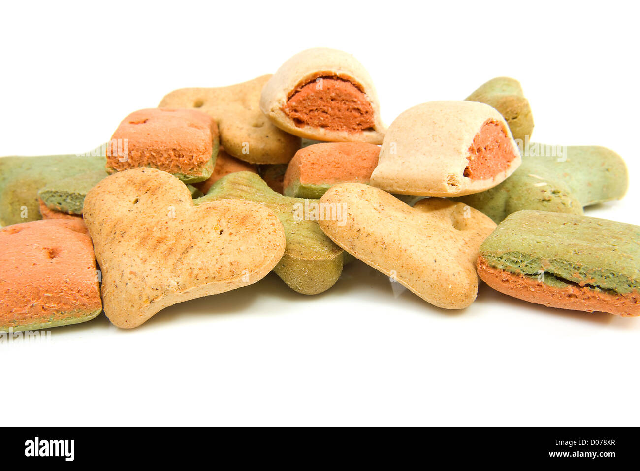 Pile of dog cookies over white background Stock Photo - Alamy