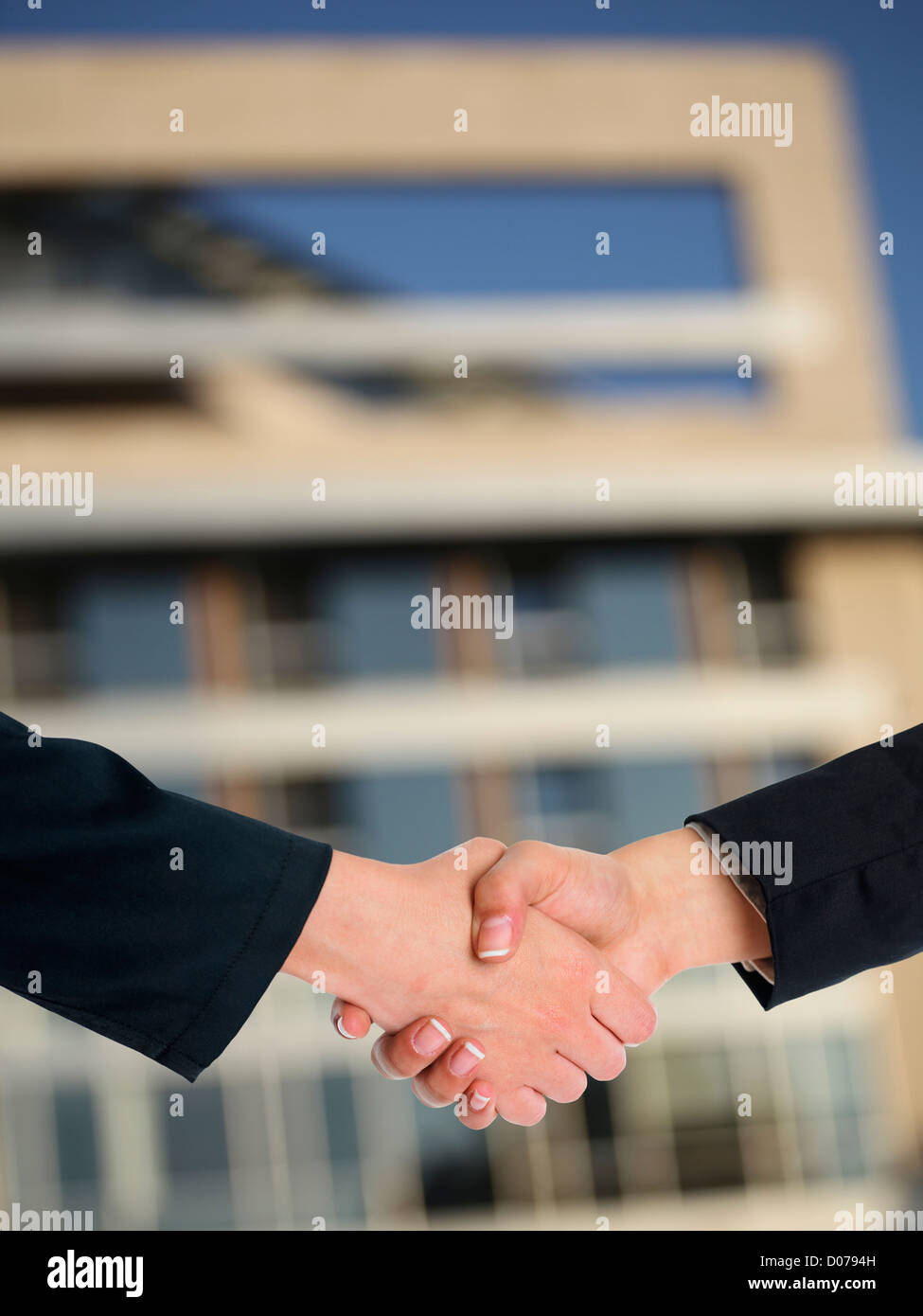 Architectural Handshaking in front of building Stock Photo - Alamy