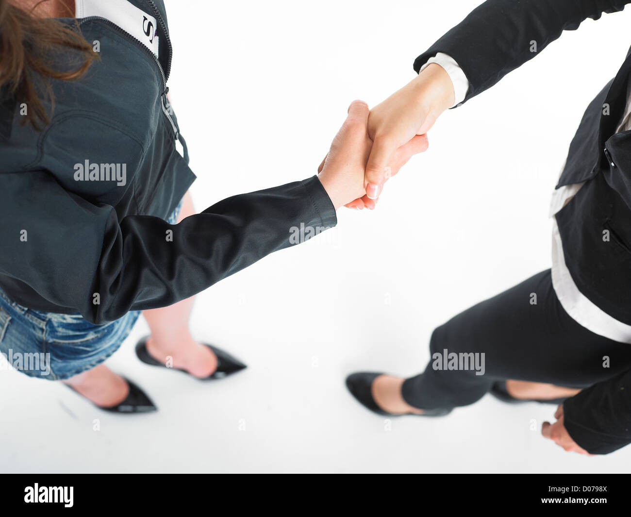 Two business woman Handshaking Handshake Stock Photo - Alamy