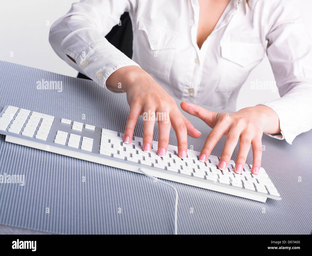 Business Woman Typing on Computer Keyboard Stock Photo - Alamy