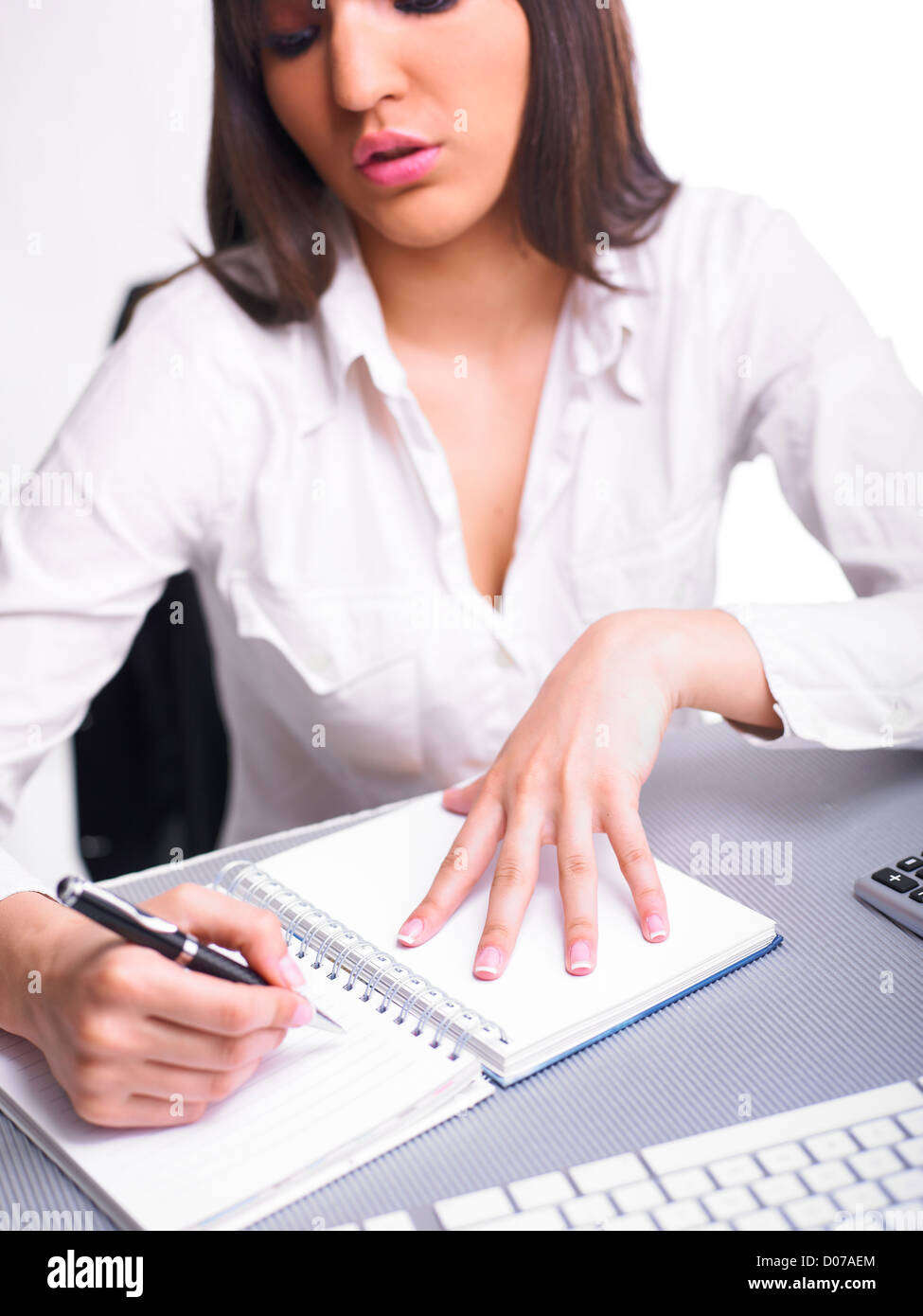 Office Assistant writing Schedule Stock Photo - Alamy