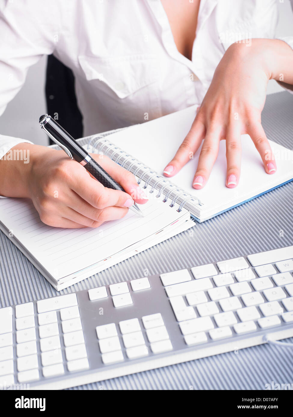 Office Assistant in white writing Schedule Stock Photo - Alamy