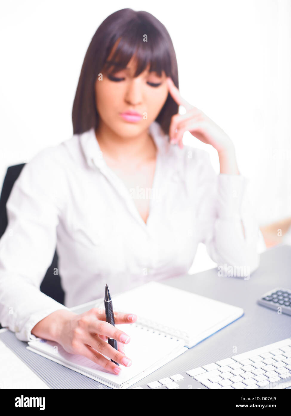Happy Business Woman Writing in notepad Stock Photo - Alamy