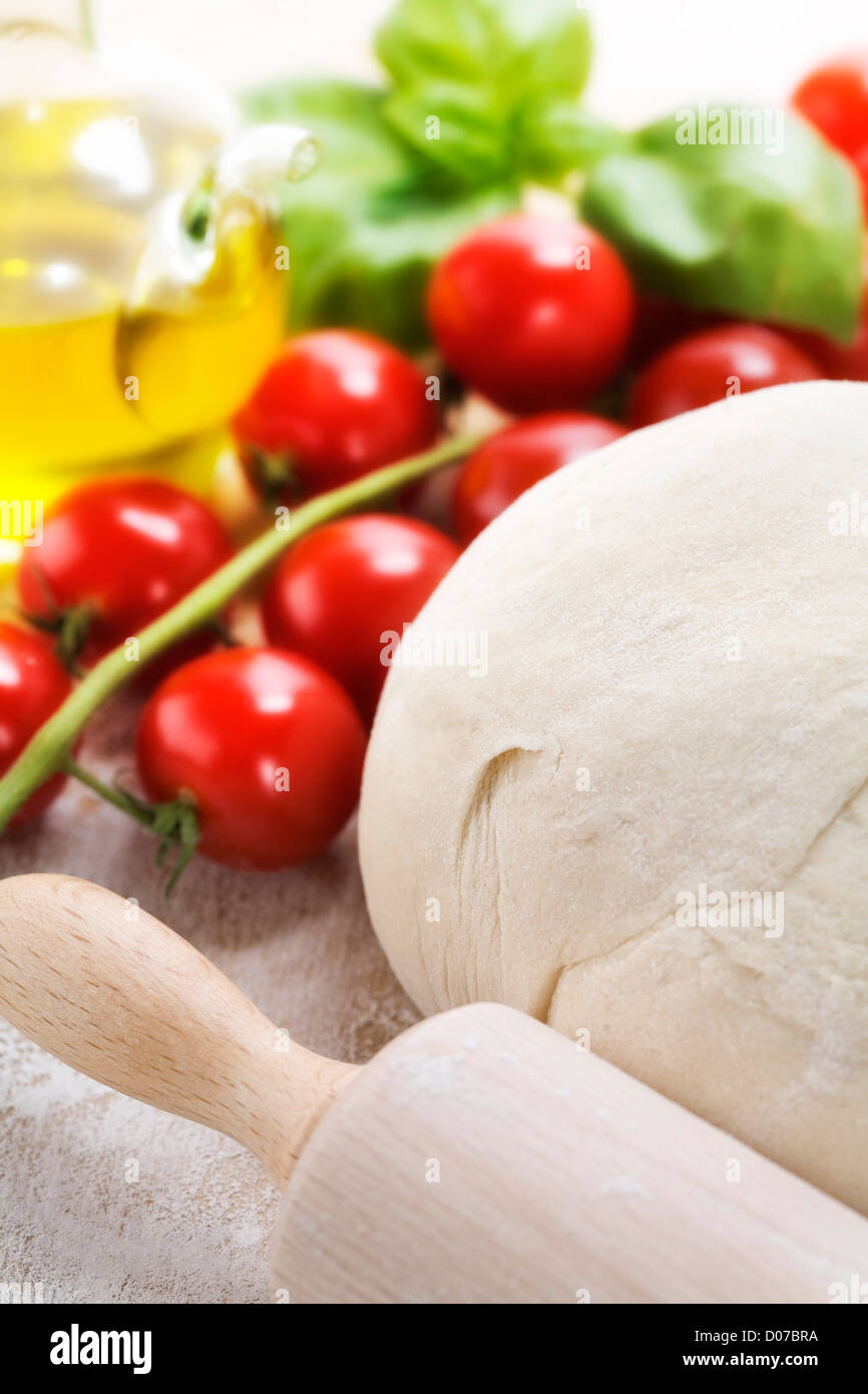 ingredients for homemade pizza(dough, cheese, olive oil and vegetables ...