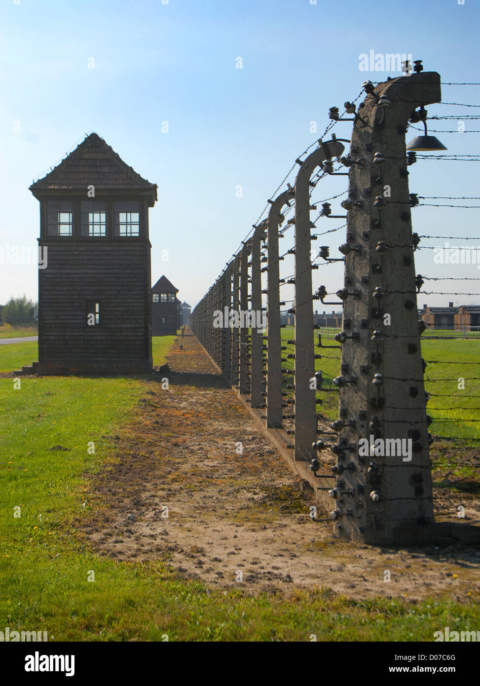 Fence, wire and a watchtower in Auschwitz Birkenau Stock Photo - Alamy