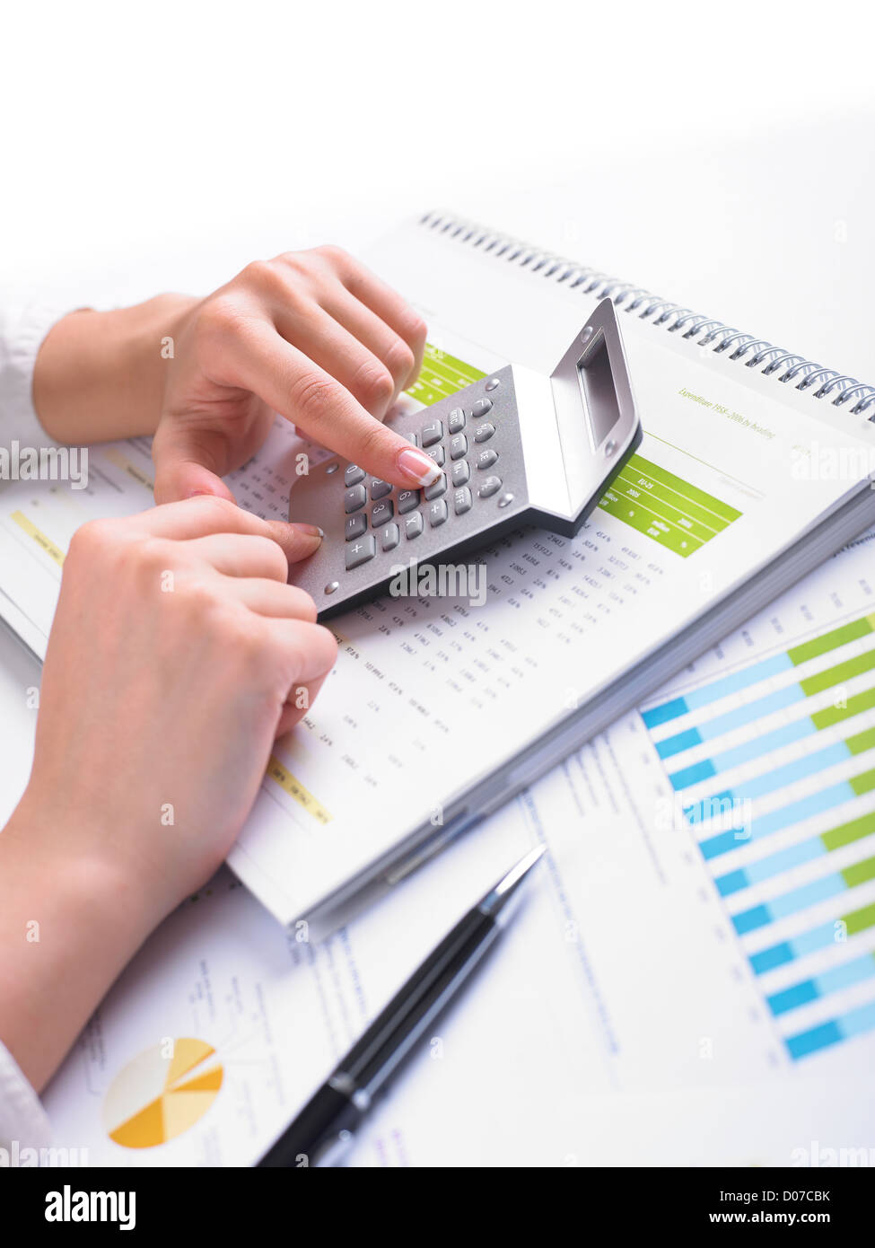 Analyzing Business Data - pen and numbers on paper Stock Photo - Alamy