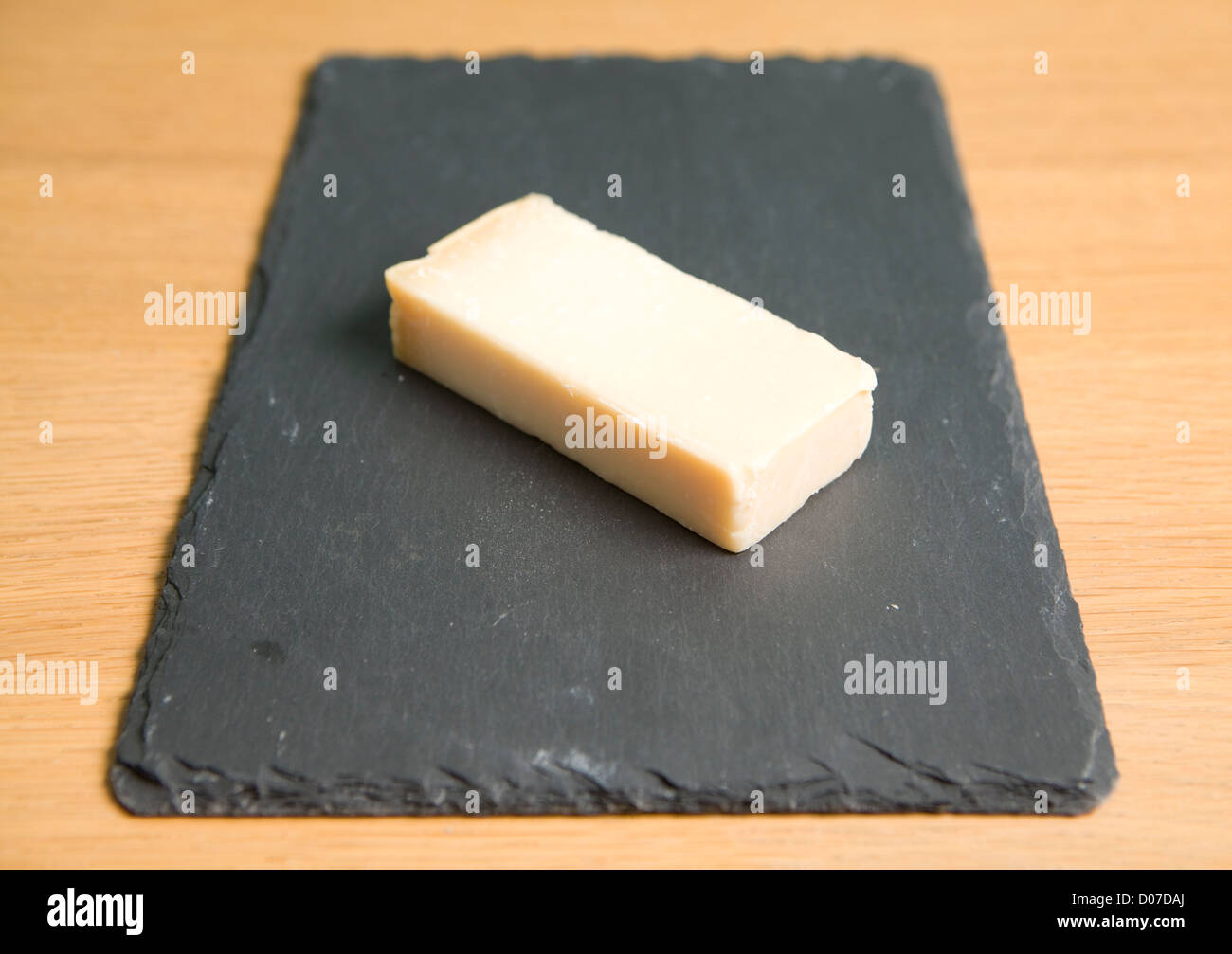 A block of Parmesan on a slate plate Stock Photo - Alamy