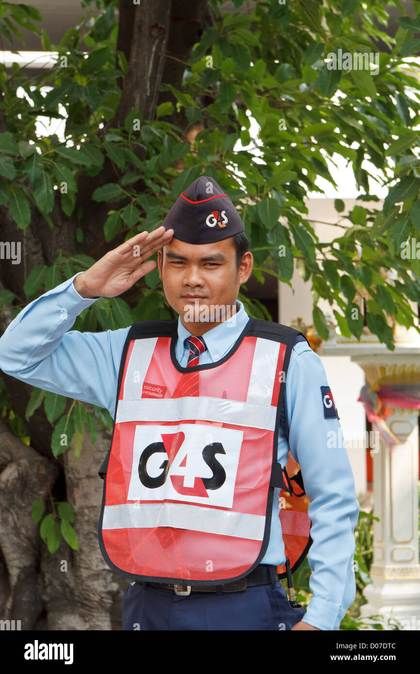 Security Guard saluting in Bangkok, Thailand Stock Photo - Alamy