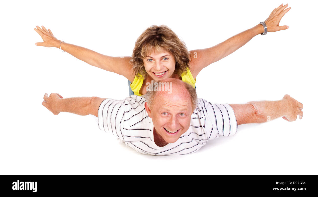 Senior couple having fun, indoors. Isolated against white Stock Photo ...