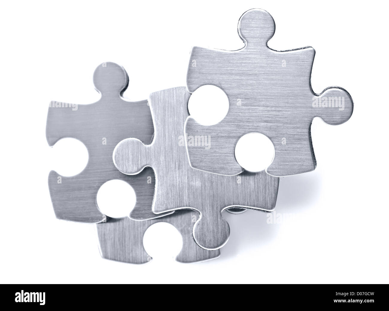 Stainless steel puzzle pieces on white background with space for text ...