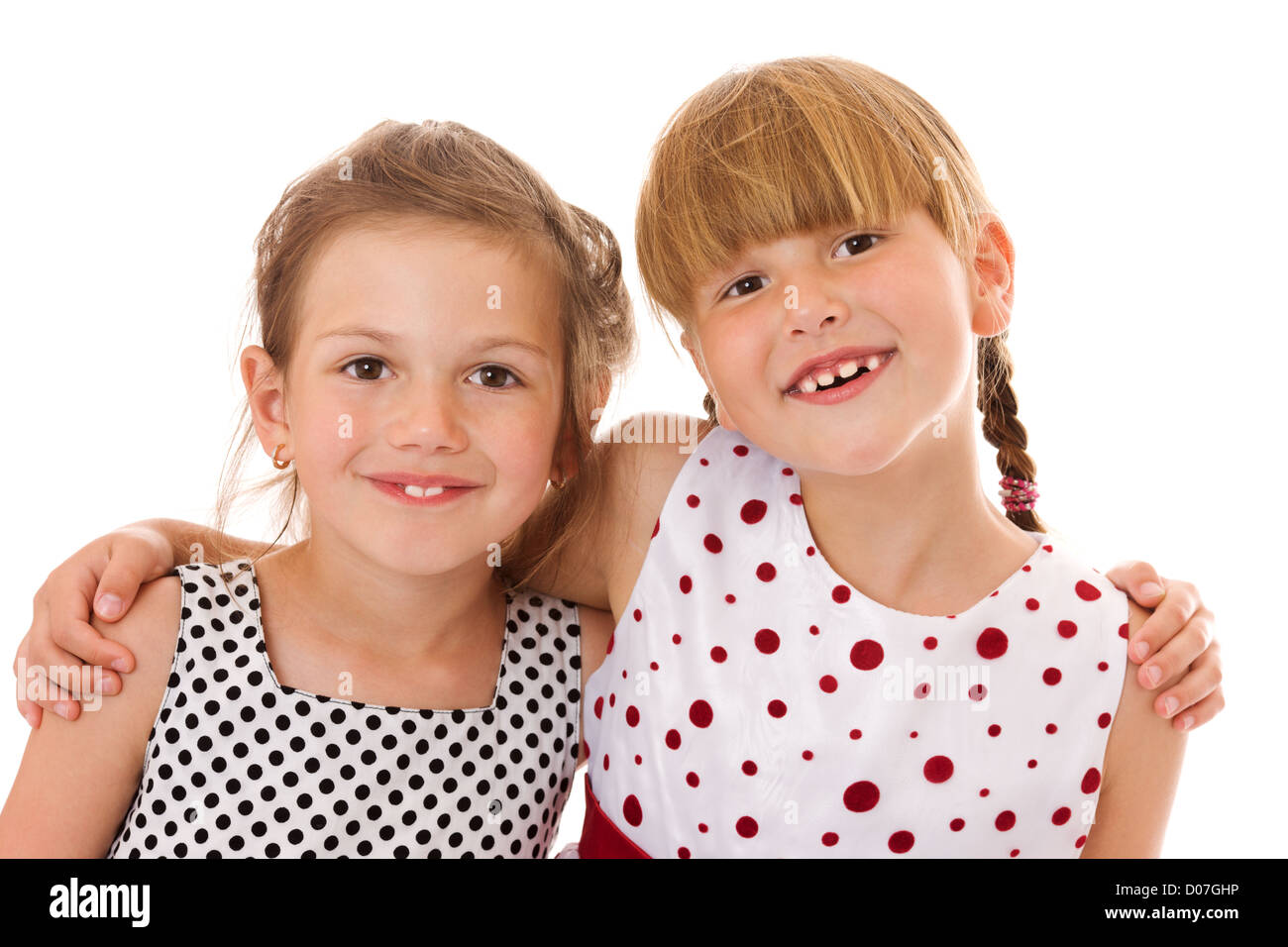 Two happy little sisters portrait isolated on white Stock Photo - Alamy