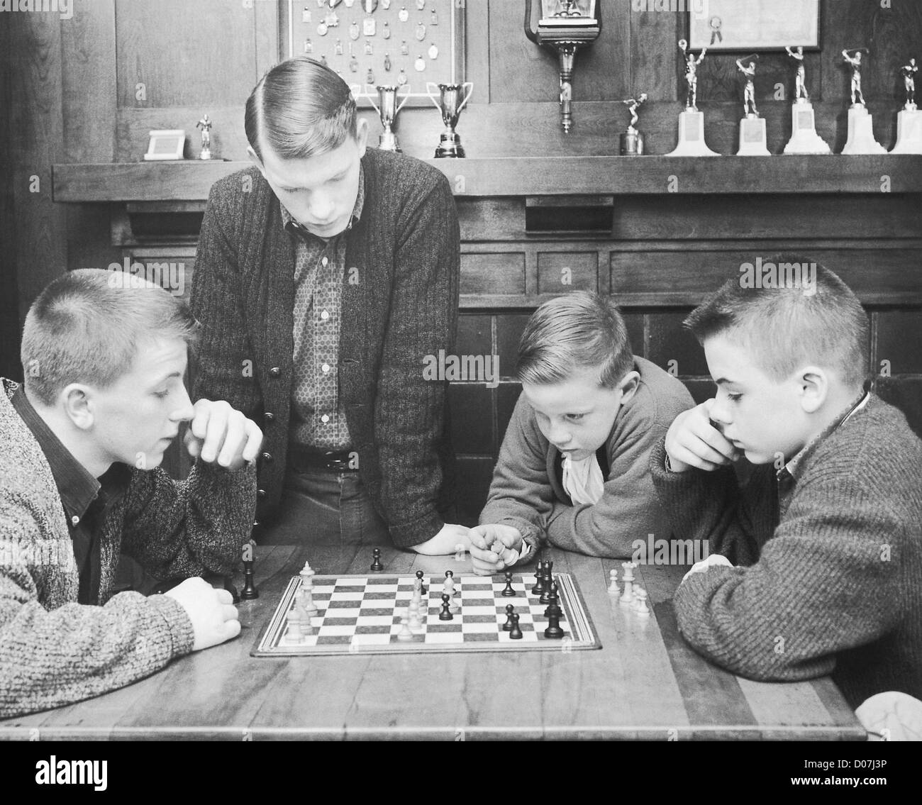 Boys playing chess Stock Photo - Alamy