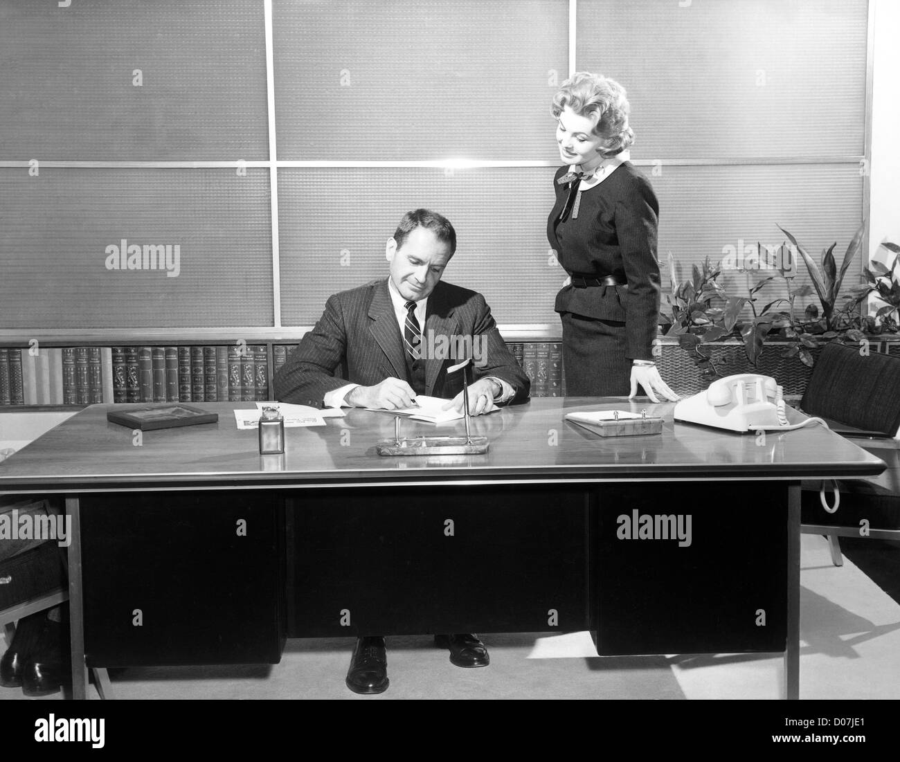 Male secretary to female boss Black and White Stock Photos & Images - Alamy