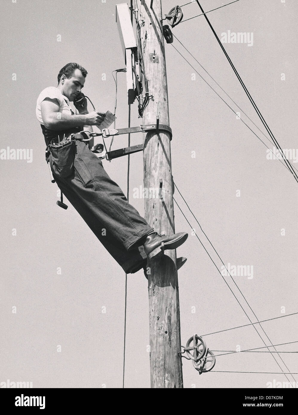 Maintenance on telephone pole Stock Photo - Alamy