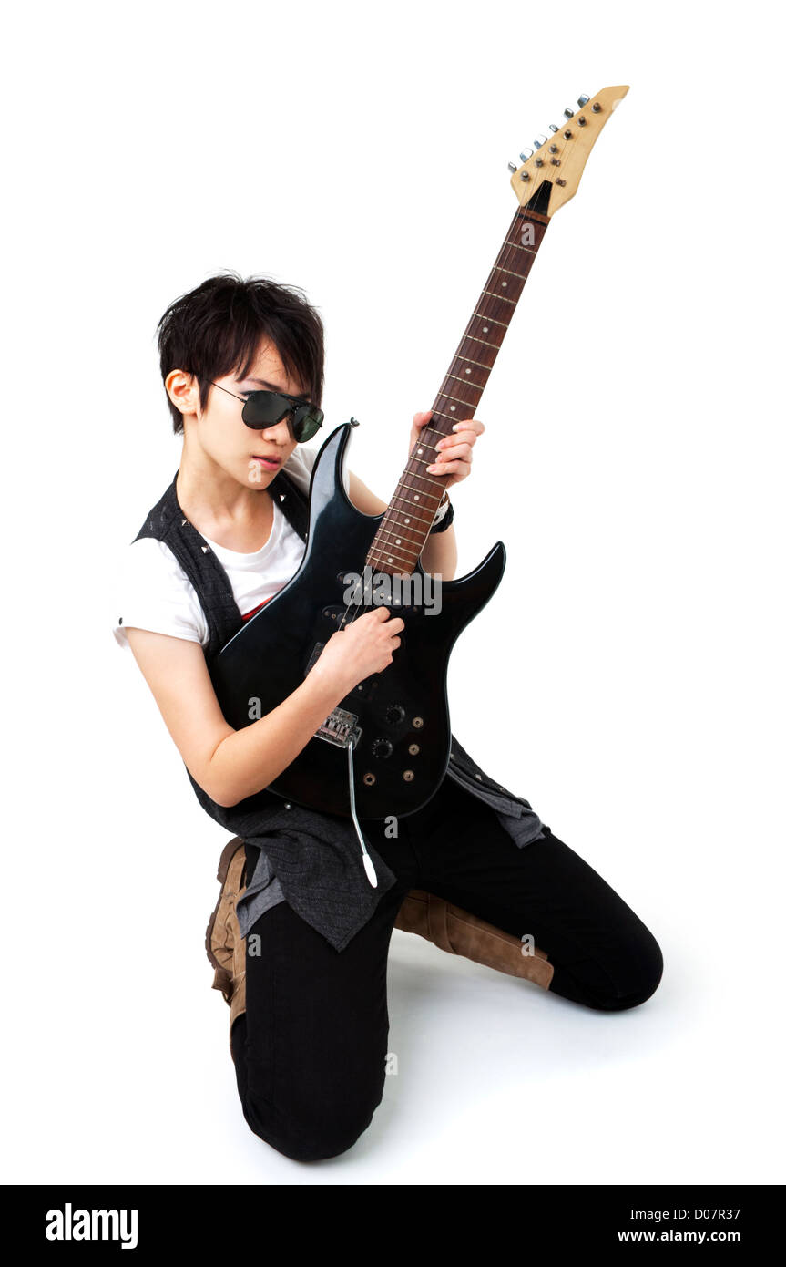 Punk Rockstar holding a guitar isolated in white Stock Photo - Alamy