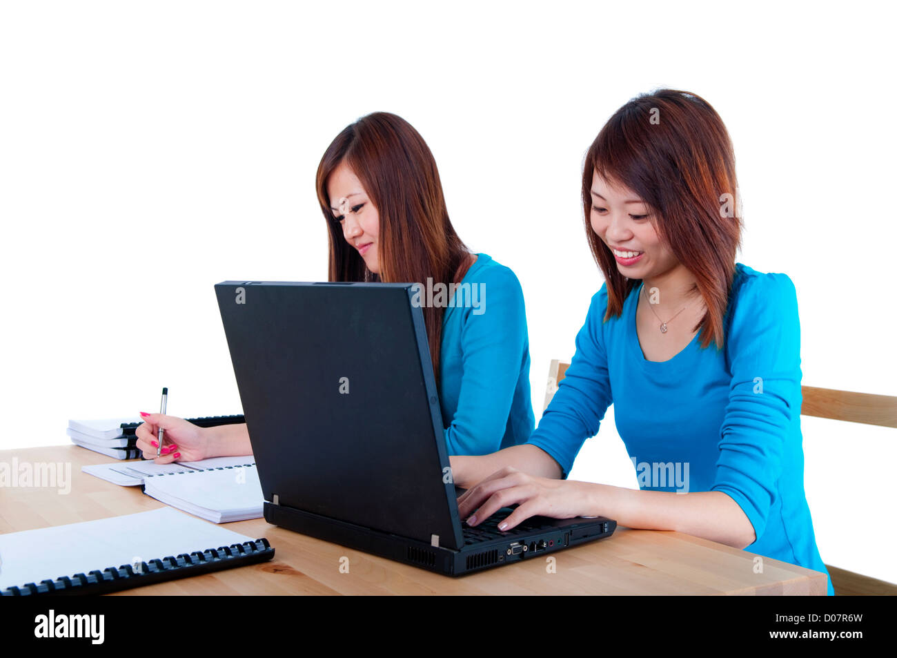 Two Asian female student studying and using computer Stock Photo - Alamy
