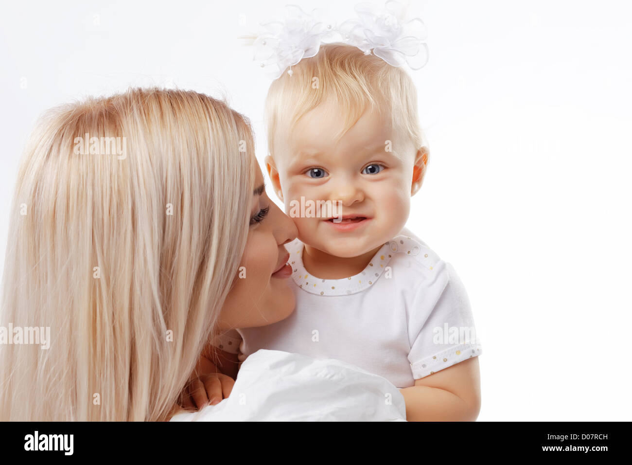Young mother with her baby studio shot Stock Photo - Alamy