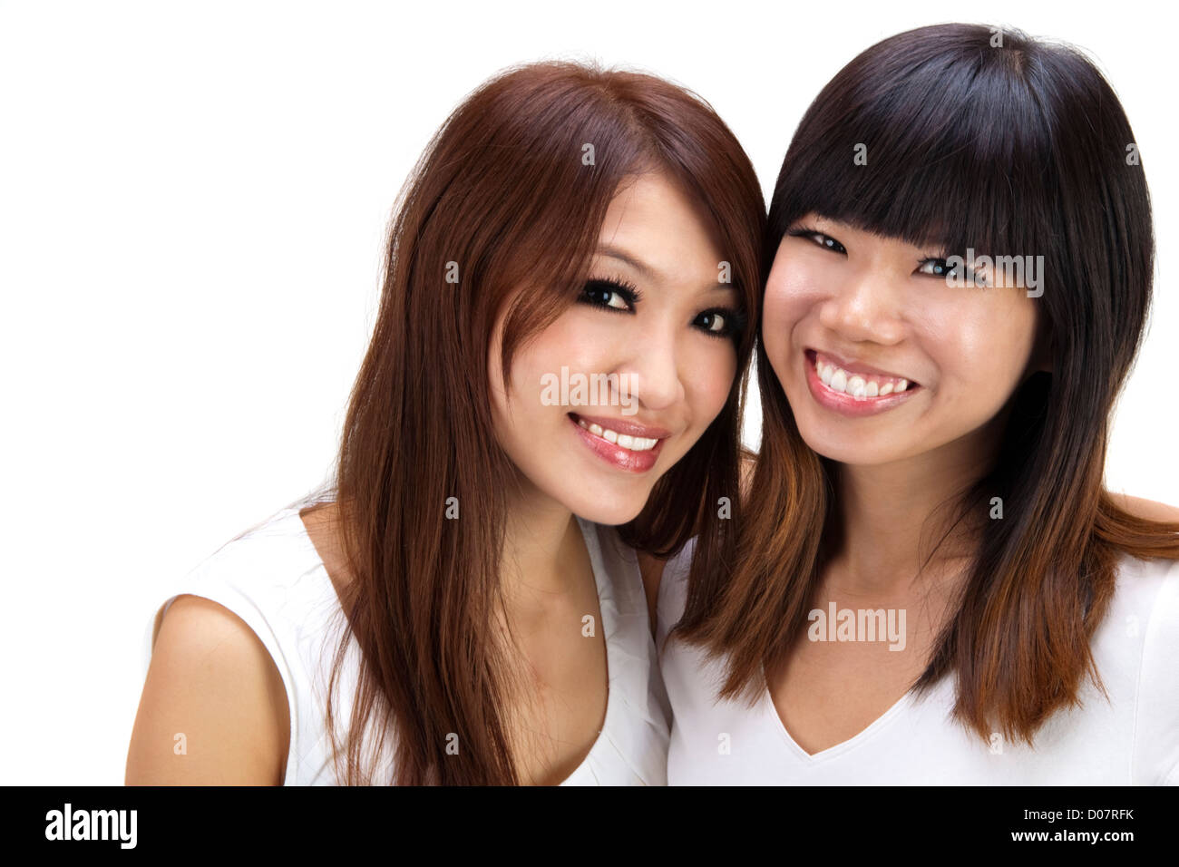 Two Asian best friend smiling on white background Stock Photo - Alamy