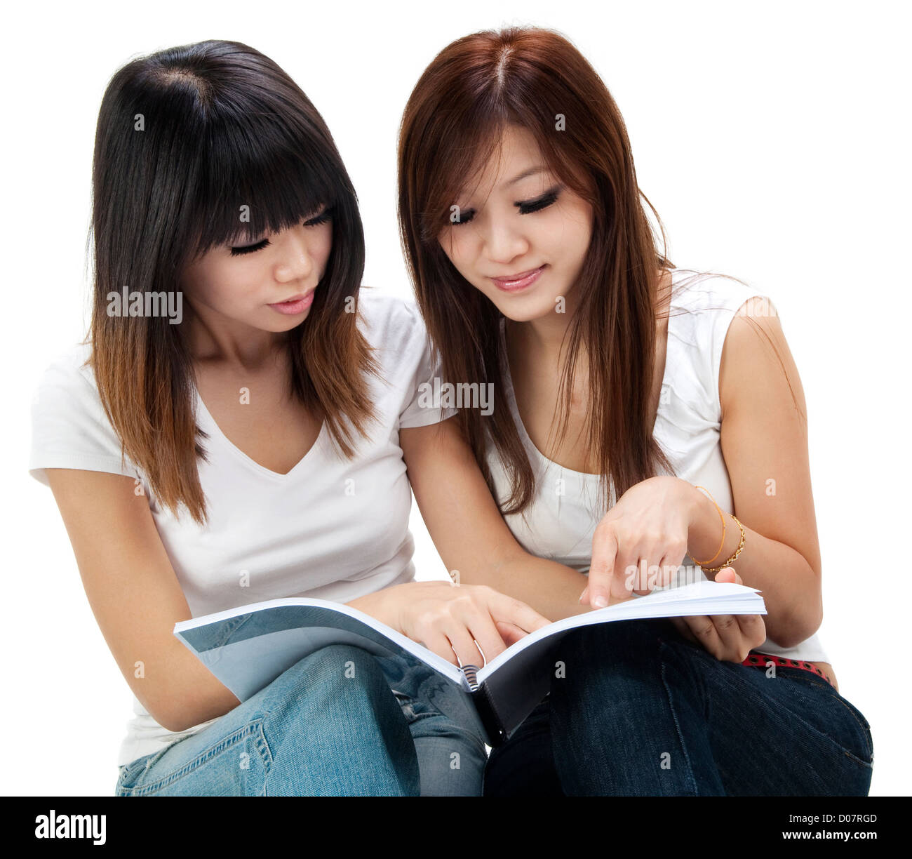 Asian students sitting learning together on white background Stock ...