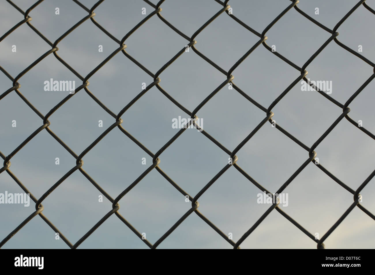 Chain Link Fence Background with Blue Sky Stock Photo - Alamy