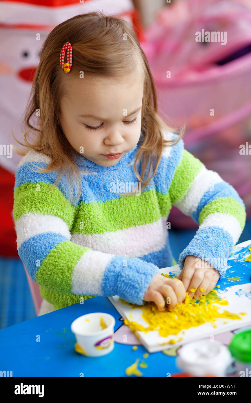 Little girl learning in her nursery at home Stock Photo - Alamy