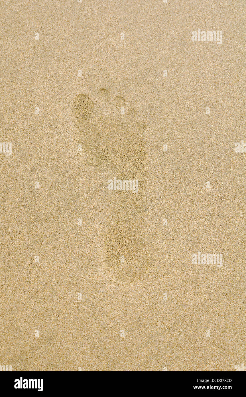 Footprint in the sand with room for text Stock Photo - Alamy