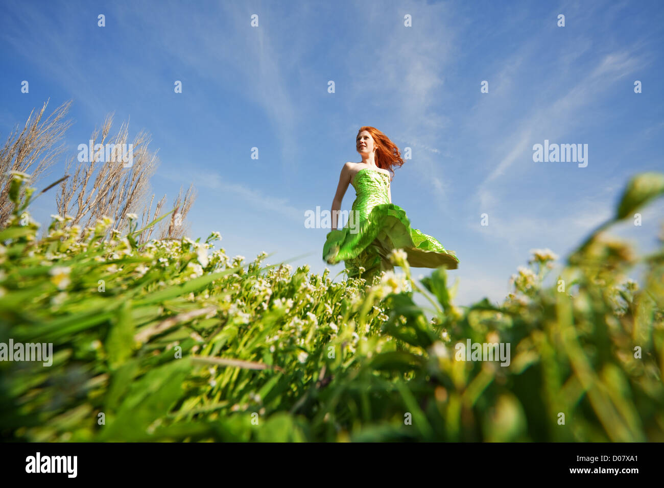 Young girl posing in field Stock Photo - Alamy