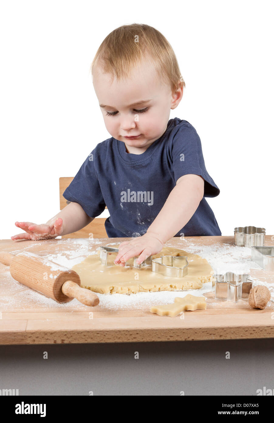 young child making cookies on small wooden desk Stock Photo - Alamy