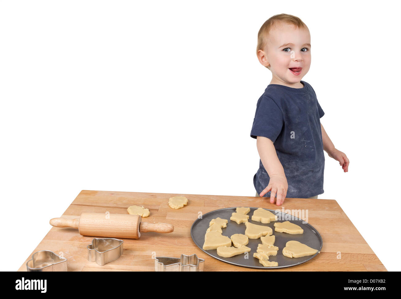 young child making cookies on small wooden desk Stock Photo - Alamy