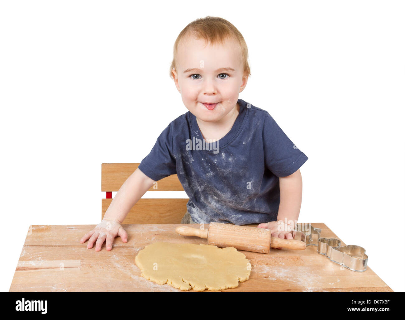 young child making cookies on small wooden desk Stock Photo - Alamy