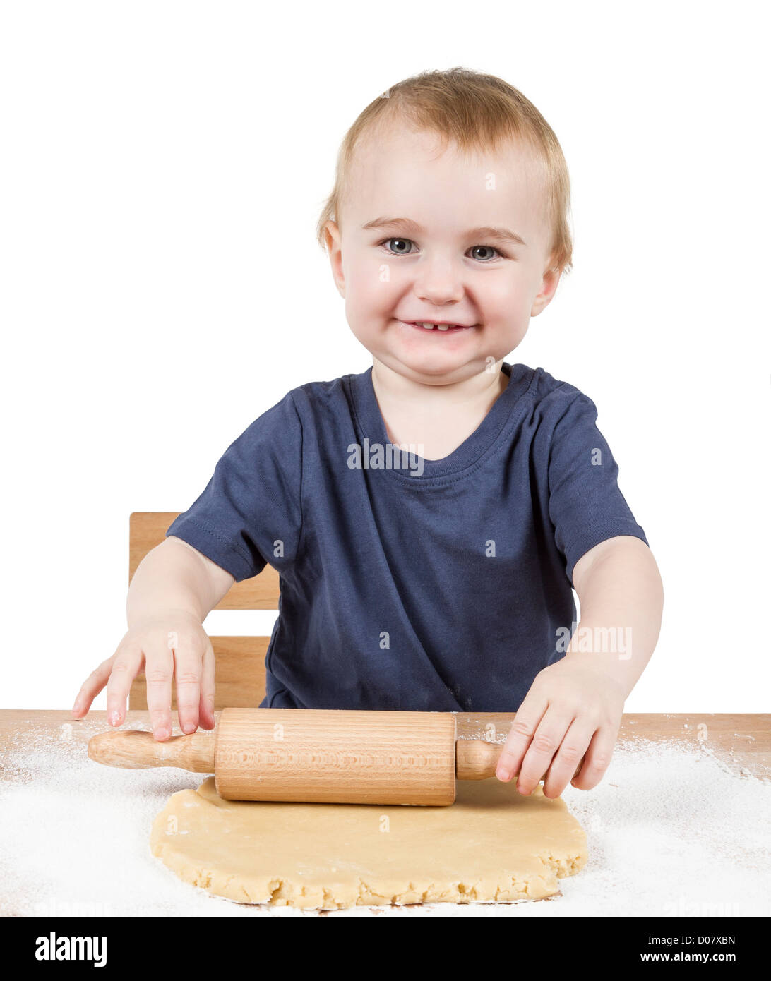 young child making cookies on small wooden desk Stock Photo - Alamy