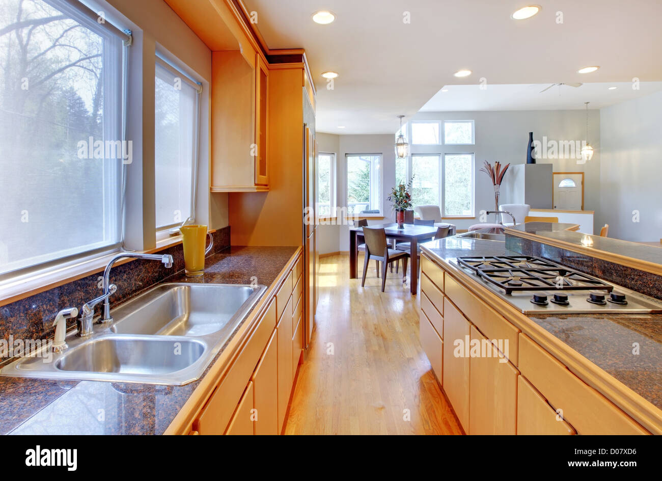 Large luxury modern wood kitchen with granite counter tops and yellow ...
